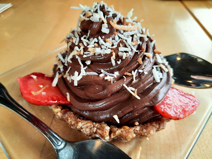 Chocolate mousse tart with coconut shavings and strawberries. Because even after the perfect seafood meal, there's always room for a little decadence.