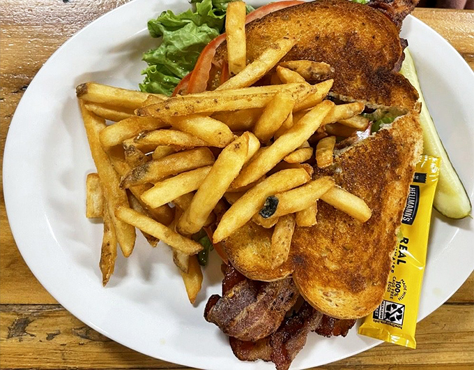 A sandwich that understands proportion &ndash; equal parts crispy bacon, fresh lettuce, and tomato on perfectly toasted bread. Simple pleasures executed brilliantly.