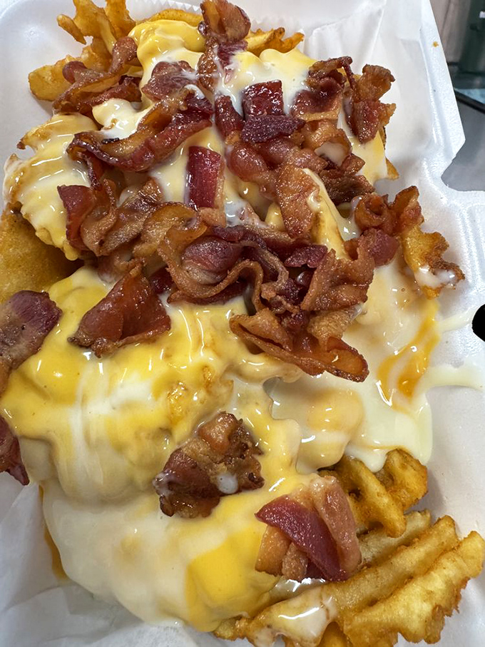 Cheese fries that understand excess is a virtue. When bacon joins the party, resistance becomes both futile and foolish.