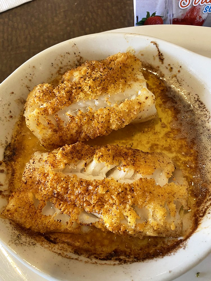 Baked cod that's dressed to impress, wearing a golden crumb coating and swimming in a buttery sauce that demands to be sopped up.