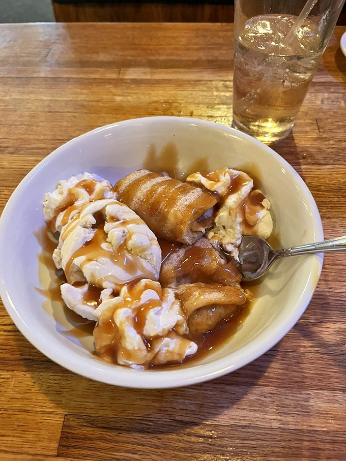 This isn't just dessert, it's therapy in a bowl. Banana pudding with what appears to be caramel sauce—comfort food that hugs your soul.
