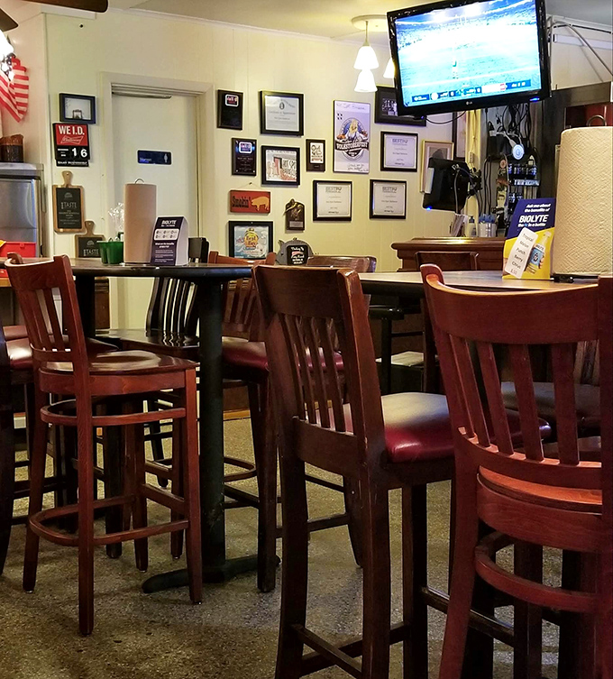 Bar seating: where solo diners become barbecue philosophers and strangers become friends over shared sauce recommendations.