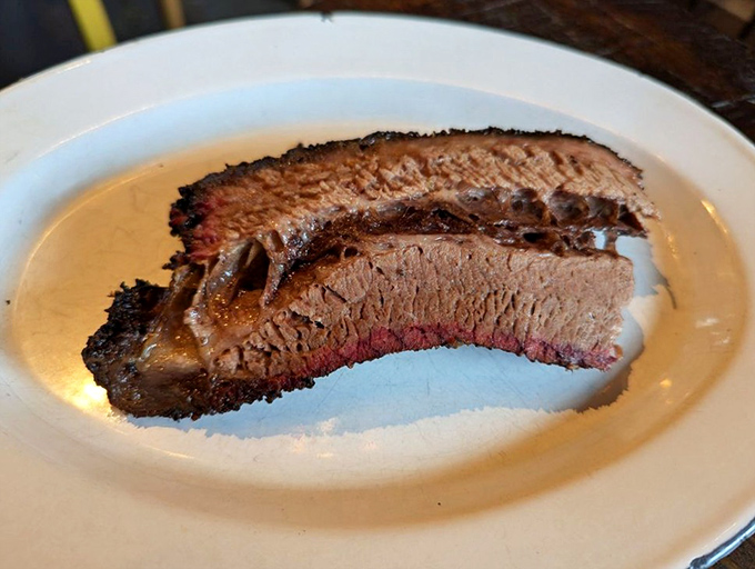 Brisket with a smoke ring so perfect it could make a Texan weep with joy. Tender, flavorful, and worth every minute of its long journey.