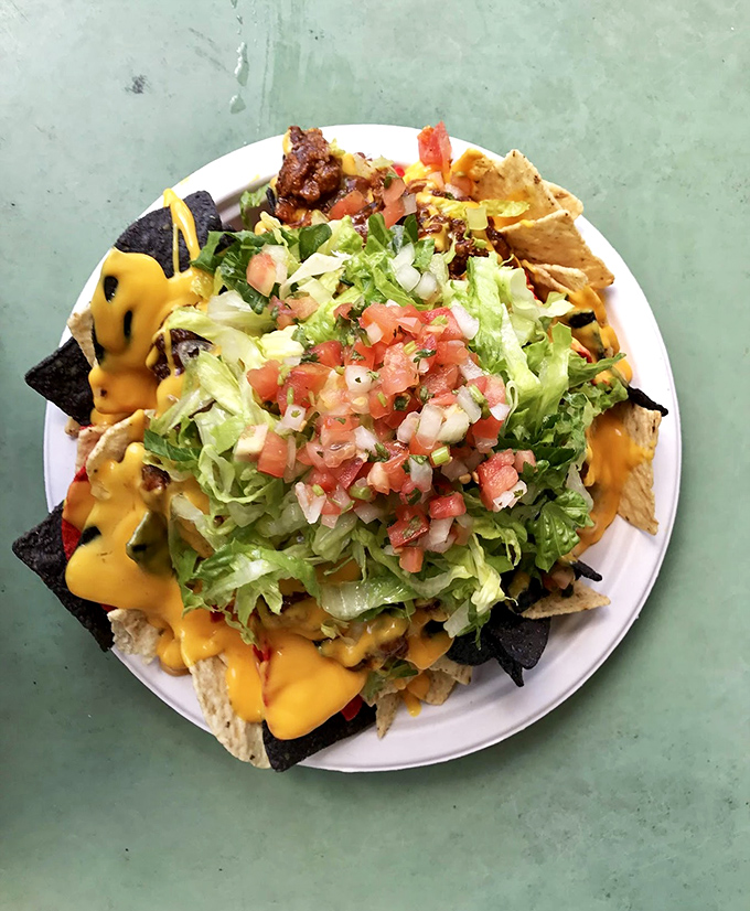 Nachos that don't apologize for their abundance. That pile of fresh pico de gallo isn't garnish – it's commitment.