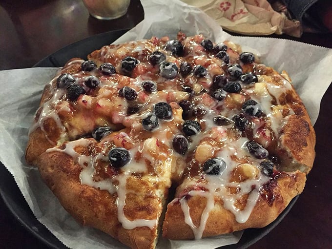 Dessert pizza with blueberries and icing – where breakfast pastry meets pizza in a rebellious fusion that somehow makes perfect sense.