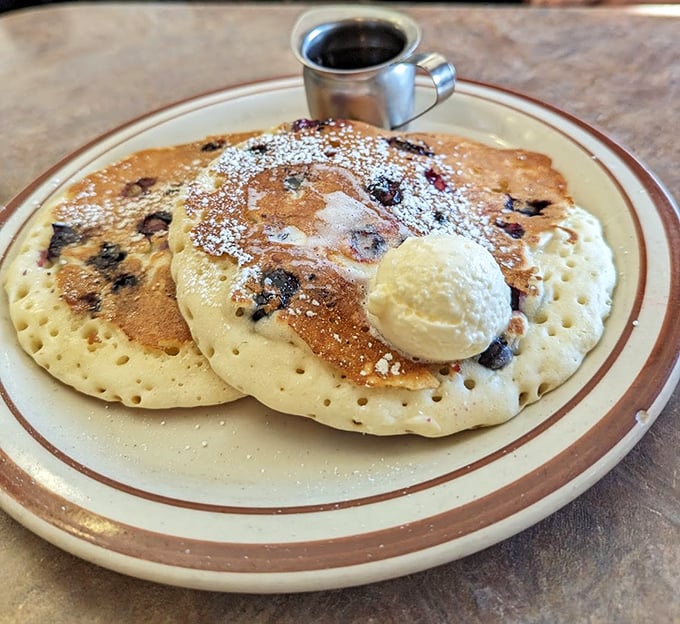 Blueberry pancakes with a scoop of butter melting like a summer romance&mdash;breakfast as dessert is always the right choice.