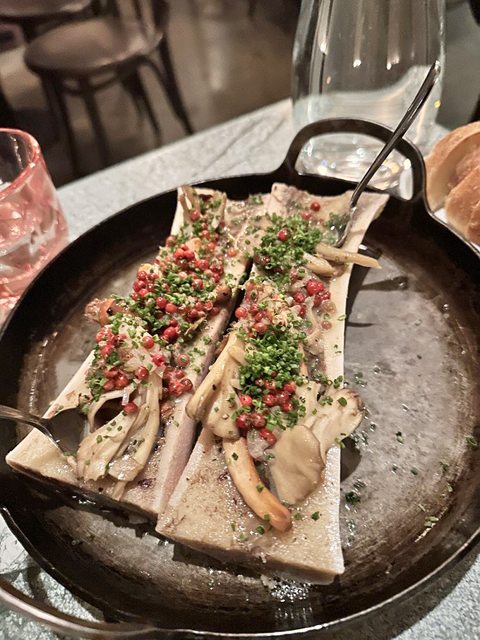Bone marrow adorned with herbs and pink peppercorns&mdash;nature's butter getting the royal treatment it deserves. Decadence you can spread with a spoon.