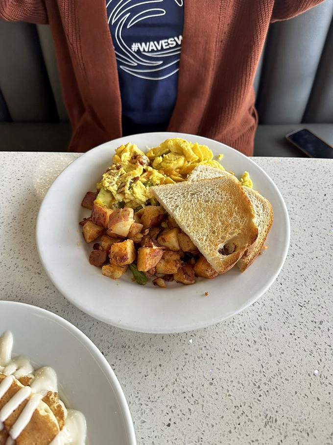 The classic breakfast trinity: fluffy scrambled eggs, golden home fries, and toast. Simple? Yes. Boring? Never. This is comfort on a plate.