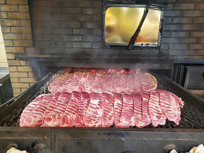Behind the scenes where the magic happens. Those ribs lined up like soldiers awaiting their delicious fate in the smoker's embrace.