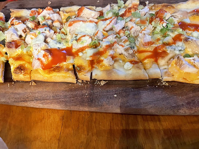 Buffalo chicken flatbread&mdash;where crispy crust meets tangy sauce in a flavor marriage that makes you wonder why you'd ever order plain pizza again.