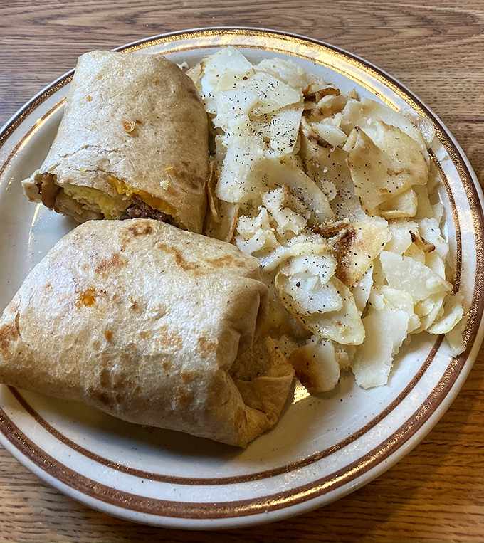 Breakfast burritos: proof that good ideas can be wrapped in a tortilla. Paired with those home fries, it's a morning game-changer.