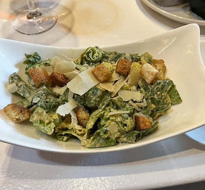 A Caesar salad that Julius himself would approve. Crisp romaine, shaved parmesan, and croutons that crunch like autumn leaves.