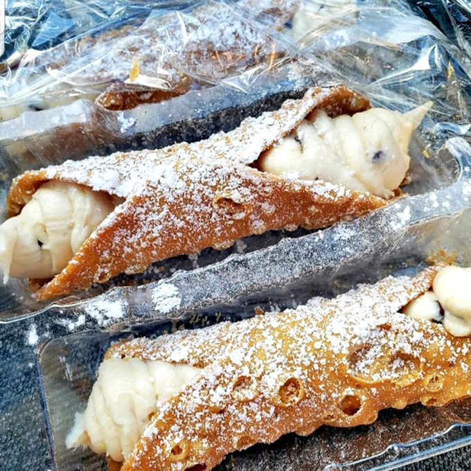Cannoli so authentic you'll check your passport. That powdered sugar dusting isn't just decoration&mdash;it's the final brushstroke on an edible masterpiece.