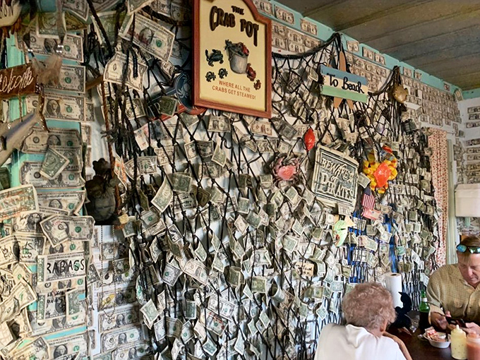 Where patrons leave their mark&mdash;and their dollar bills. This wall of currency tells more stories than most restaurant guest books ever could.