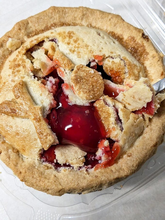 Cherry filling erupting through golden crust like nature's lava lamp. This isn't just a pie &ndash; it's a geological event worth documenting.