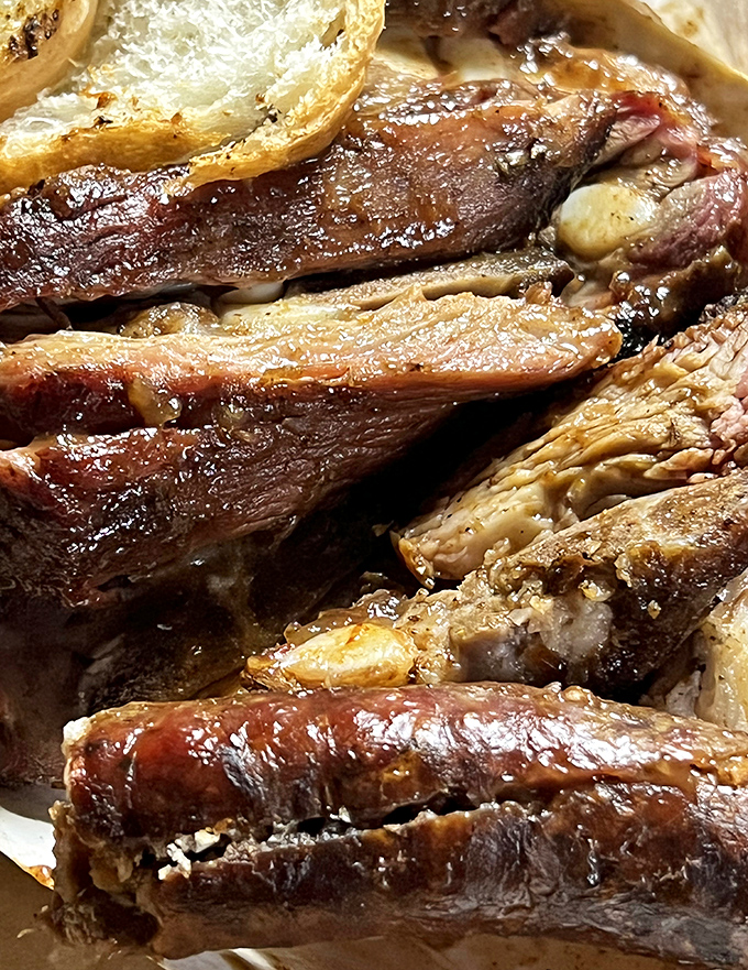 When meat meets bread with sauce as mediator, magic happens. This close-up could make a vegetarian question their life choices.
