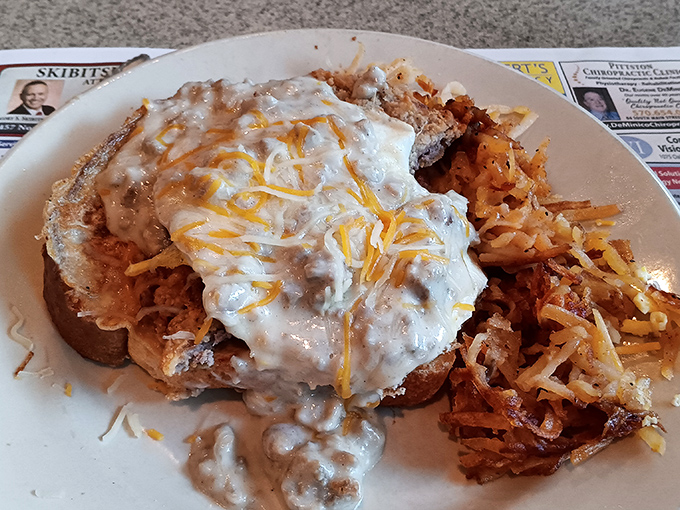 This isn't just breakfast&mdash;it's edible architecture with gravy-smothered goodness and hash browns that deserve their own fan club.