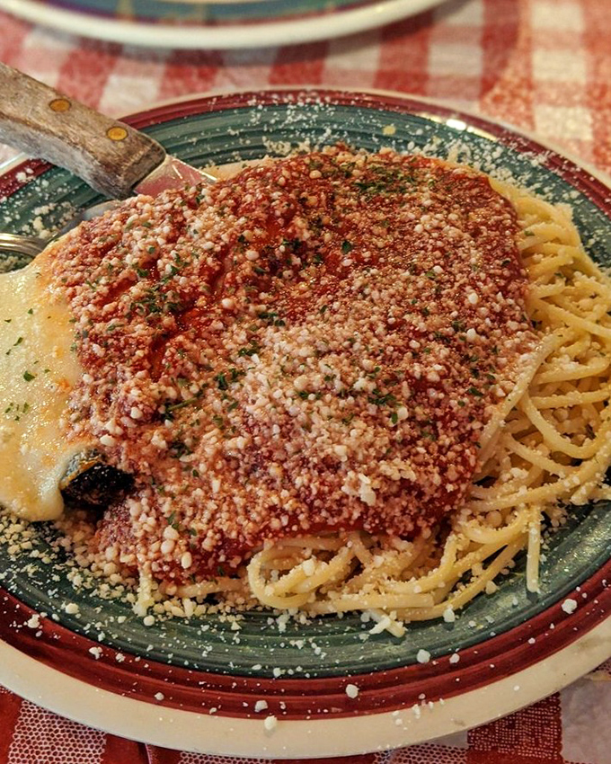 Chicken parmesan that's doing the impossible: staying crispy under a lava flow of marinara and enough cheese to make Wisconsin proud.