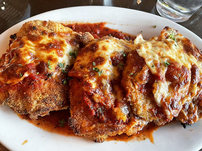 Chicken Parmigiana that doesn't hide under a mountain of cheese, but proudly showcases its perfectly crisp exterior and juicy interior. A textbook example done right.