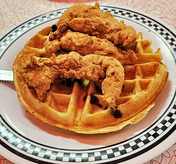 Chicken and waffles – that perfect marriage of sweet and savory, crispy and fluffy – executed with the confidence of a diner that knows exactly what it's doing.