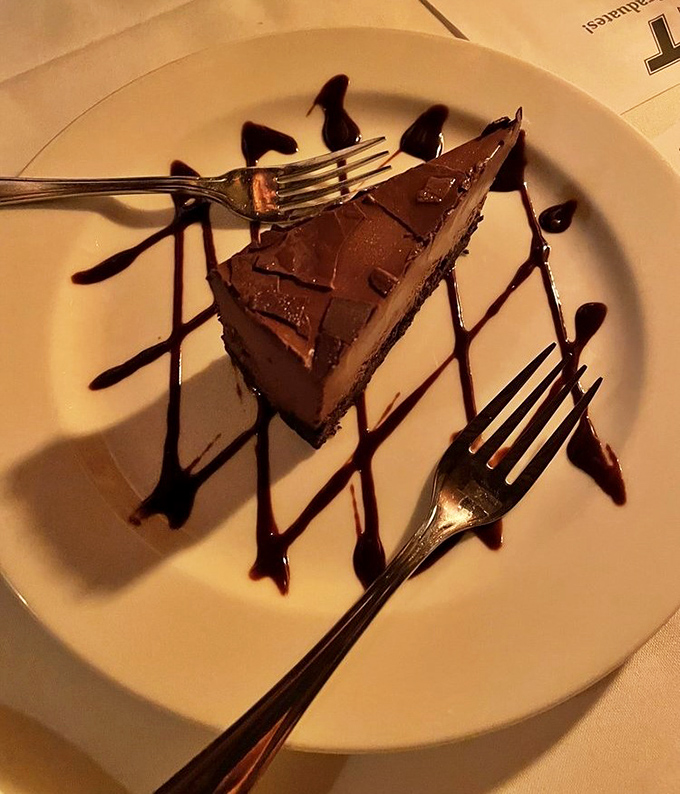A chocolate dessert so rich it should come with its own tax bracket. Worth every calorie-laden forkful.