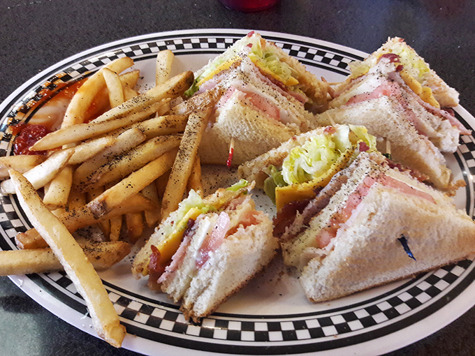 Club sandwiches: the architectural marvel of diner cuisine, where each perfectly cut triangle is a testament to sandwich engineering.