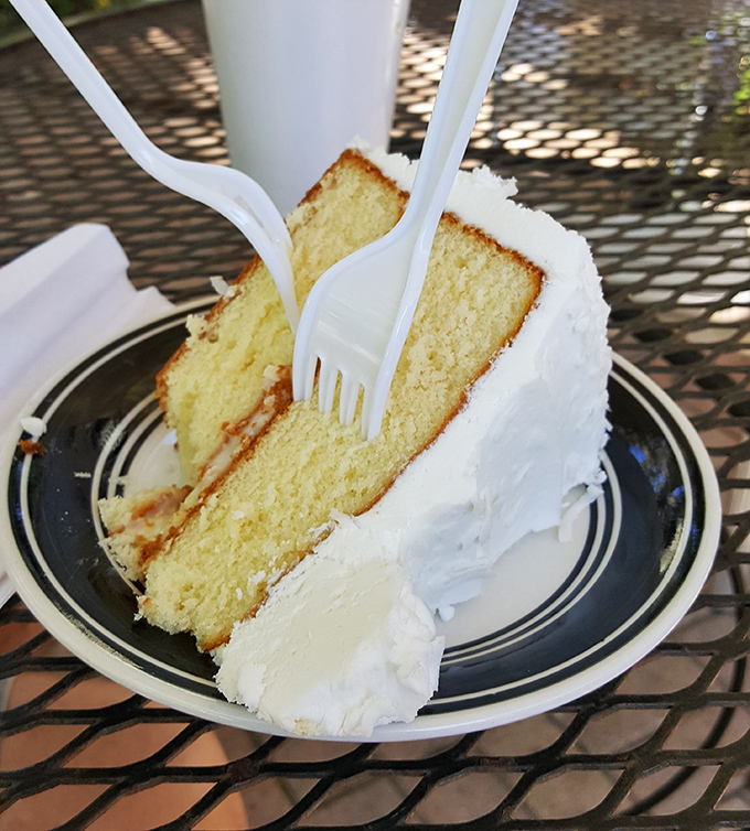Coconut cake so tall and fluffy, it practically needs its own weather system.