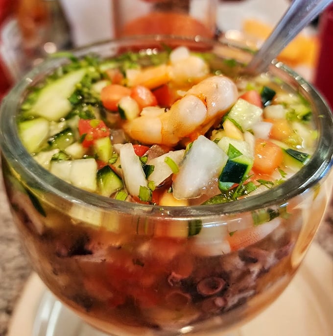 A seafood cocktail that's part ocean, part garden, all delicious. The cucumber and tomato bring freshness while shrimp and octopus bring depth.