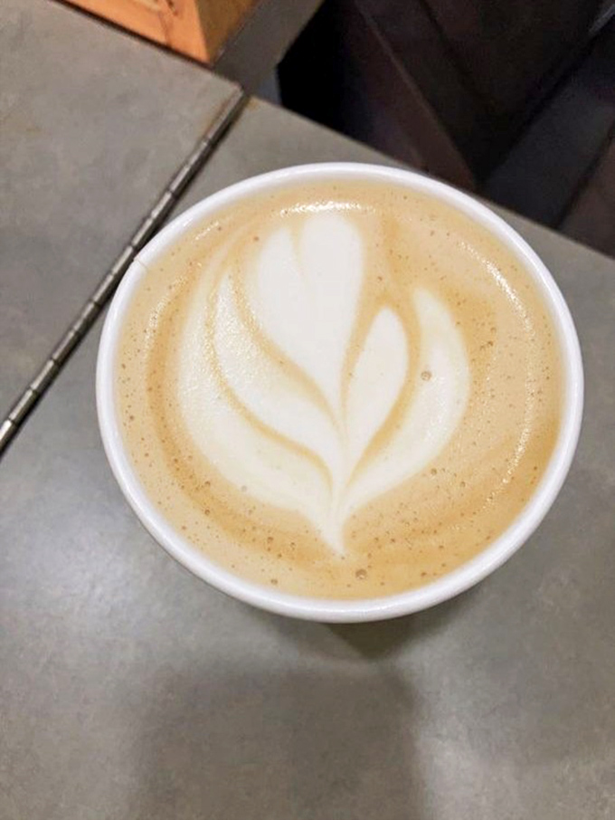 Coffee art so pretty you almost don't want to drink it. Almost. The heart design is the barista's way of saying, "Yes, this will be worth every sip."