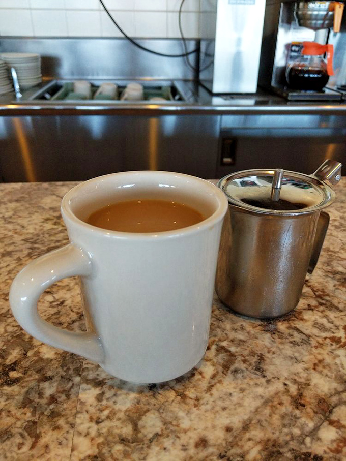The humble coffee mug &ndash; holding what might be the most important relationship in your morning. That creamer stands ready for duty.