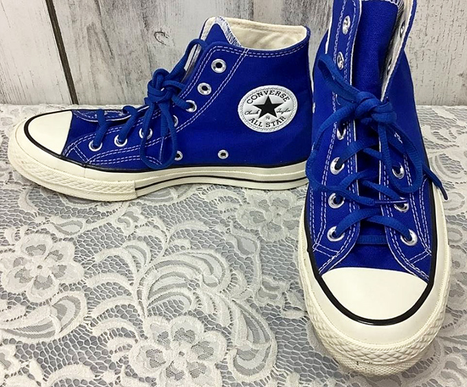 These electric blue Converse All-Stars aren't just shoes—they're personality statements waiting for the right feet to continue their story.