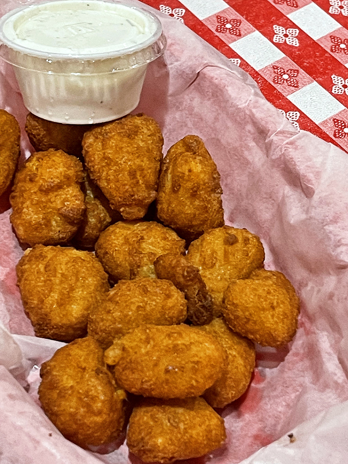 Golden nuggets of corn batter that crunch like nature's candy. The side dish that steals the spotlight and makes you forget your table manners.