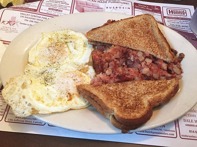 Corned beef hash with perfectly cooked eggs, proving that some breakfast combinations are simply meant to be together.