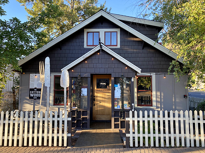 Cottonwood Cafe's charming facade hiding culinary treasures within. That white picket fence isn't just decorative&mdash;it's containing all the small-town perfection.