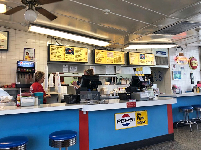 Behind this blue counter, hot dog artisans have been perfecting their craft for decades. No fancy culinary school required&mdash;just dedication to the perfect bite.