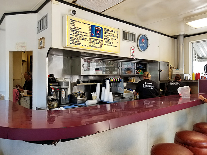 Behind this counter, burger magic happens with the efficiency of a Swiss watch and the soul of a Motown hit &ndash; precise yet full of heart.