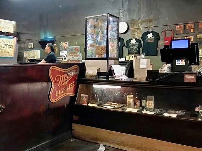 The counter where barbecue dreams come true. That Miller High Life logo isn't just decoration &ndash; it's a promise of authenticity.