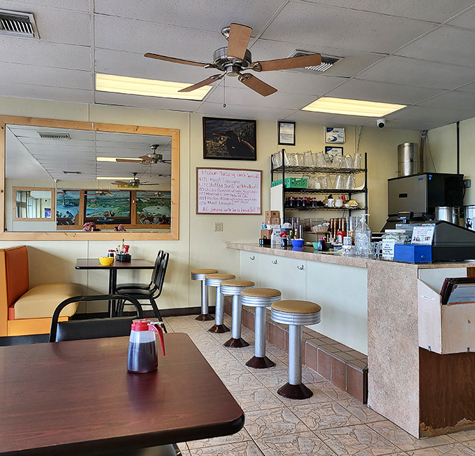 The counter seating—where solo diners become temporary family and coffee refills appear before you even realize you need one.