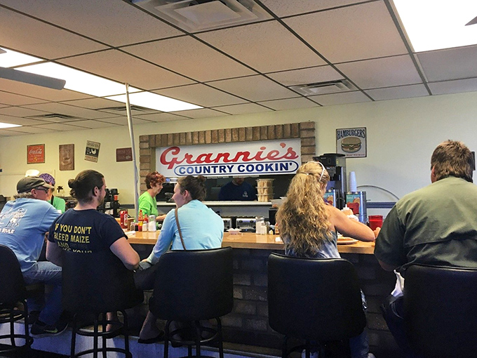 The counter seating offers front-row tickets to the culinary show, where regulars exchange news between bites of biscuits.