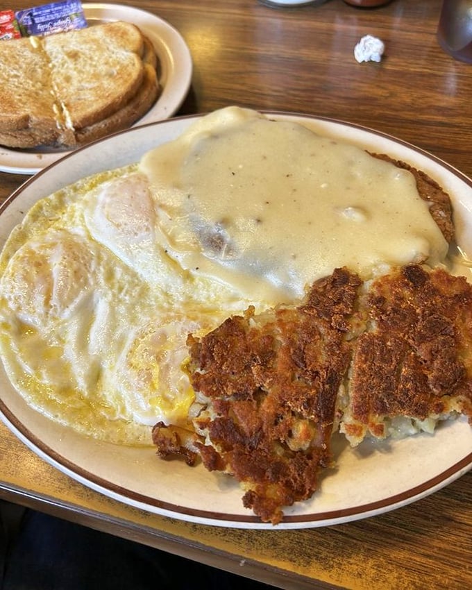 Country fried steak with gravy, eggs, and hash browns&mdash;the breakfast equivalent of a warm hug from someone who genuinely wants you to have a good day.