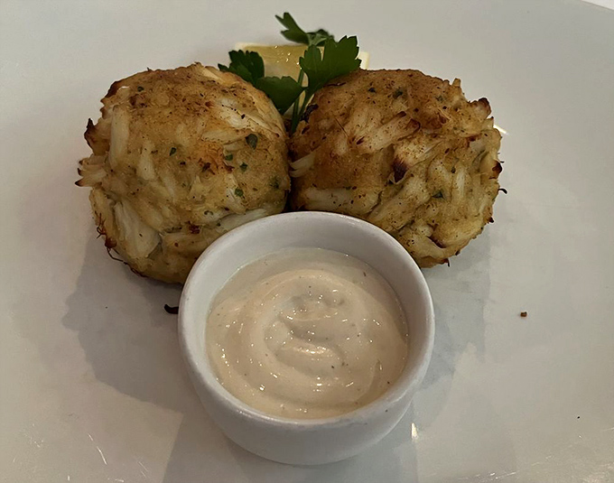 These crab cakes are what Maryland dreams about&mdash;mostly crab, minimal filler, and a sauce that makes you want to lick the plate.