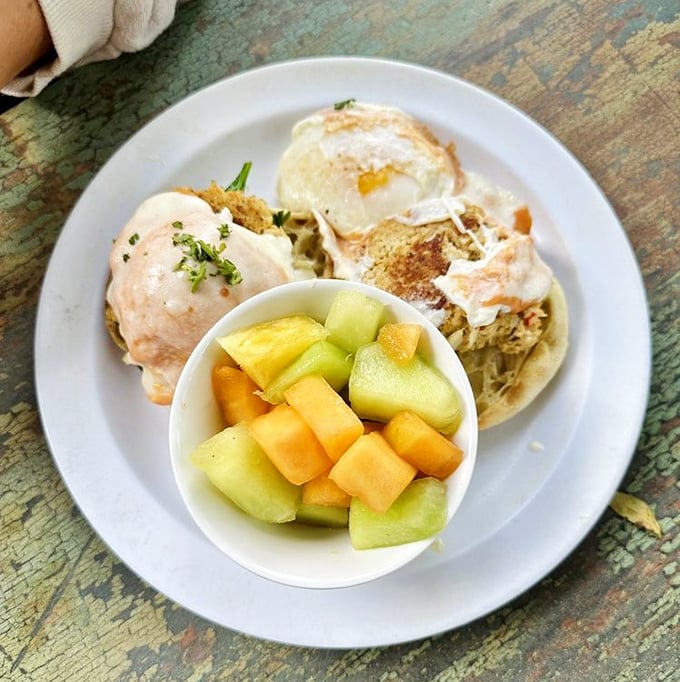 Eggs Benedict gets a coastal makeover with these crab cakes. The fresh fruit cup isn't just healthy&mdash;it's strategic planning for more hollandaise.
