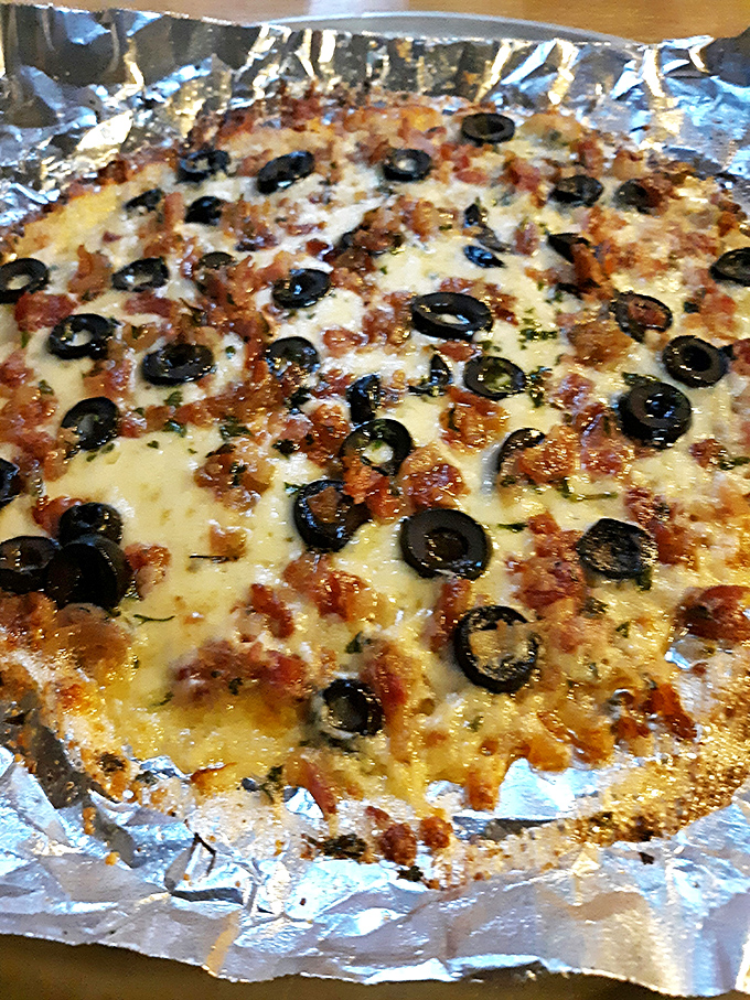 Crustless pizza for the carb-conscious, proving even covered bridges can adapt to modern dining trends.