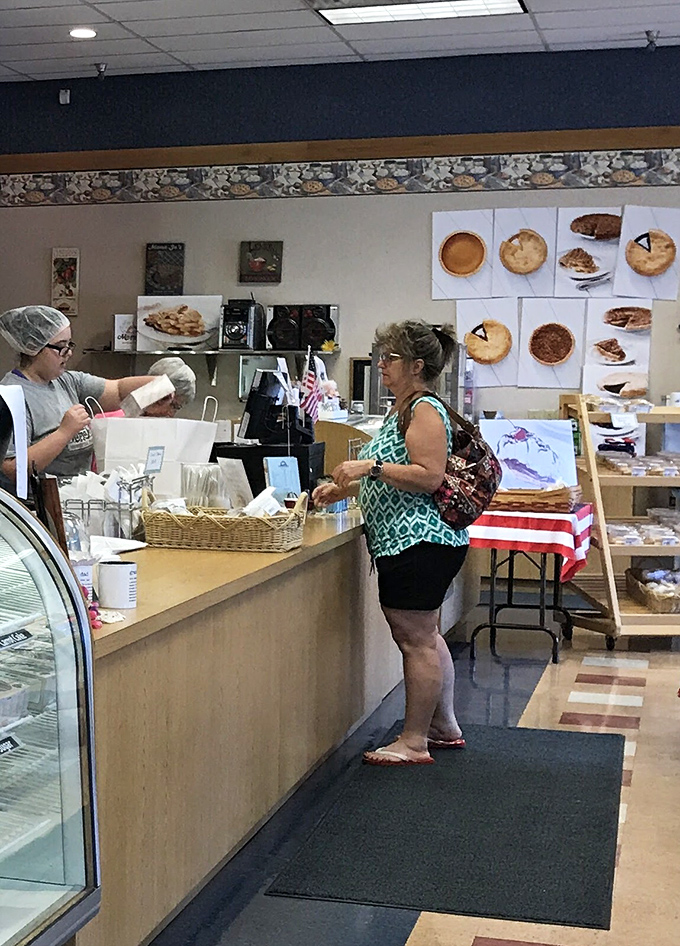 The time-honored tradition of pie procurement in progress. That look of anticipation is universal&mdash;pie joy knows no boundaries.