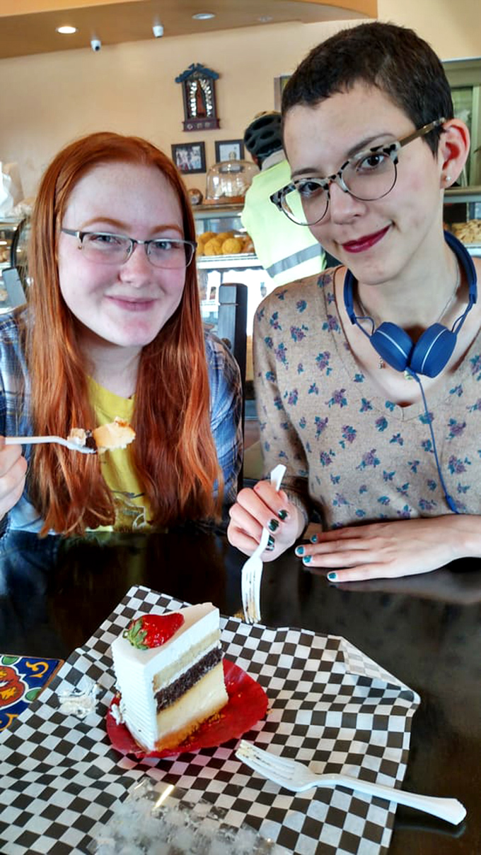 Happy customers experiencing that universal moment of pre-bite anticipation. Some food memories aren't just made&mdash;they're carefully constructed, one forkful at a time.