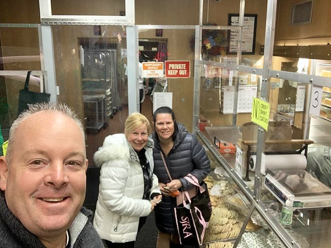 Happy pilgrims at the promised land of pound cake. Their smiles say what we're all thinking: "Worth the trip!"