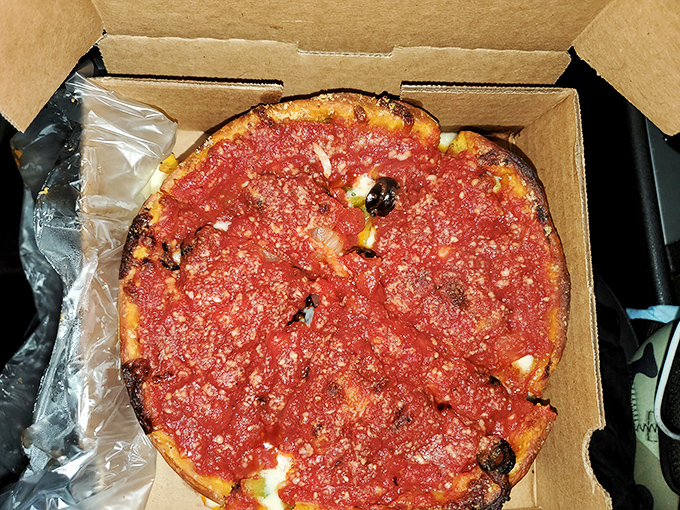 Chicago-style pizza in its natural glory&mdash;a deep dish masterpiece where the sauce-to-cheese ratio achieves mathematical perfection.