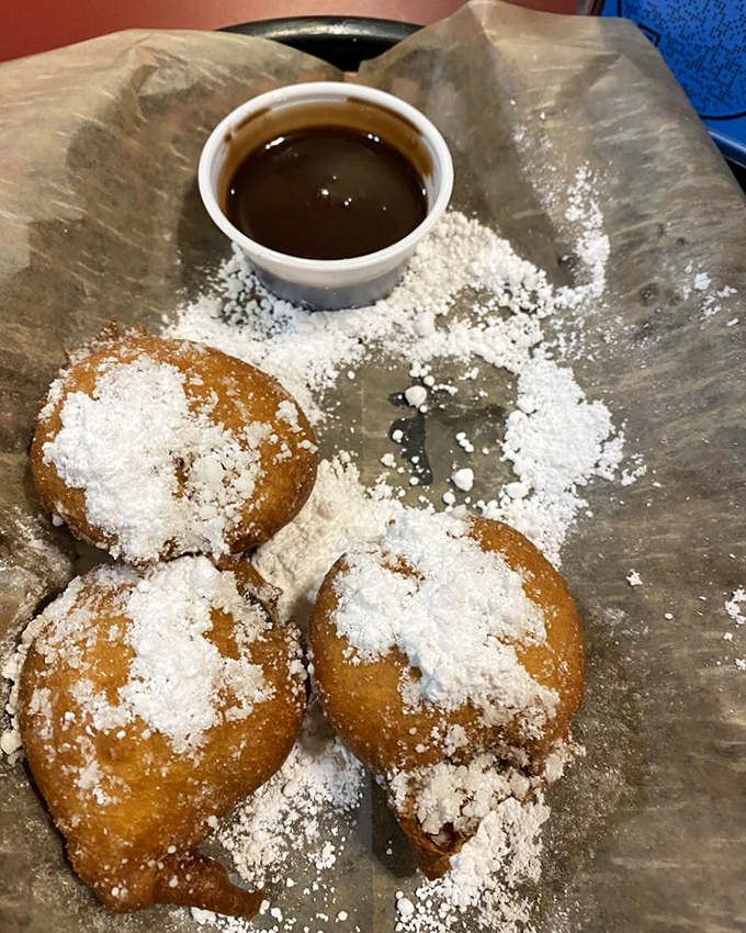 Deep-fried Oreos with powdered sugar and dipping sauce—because sometimes dessert needs to be as indulgent as the main course.