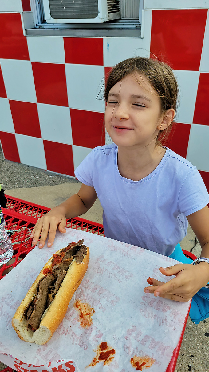 The wall of fame tells stories of satisfied customers past. Philip's history displayed proudly alongside the ordering window.