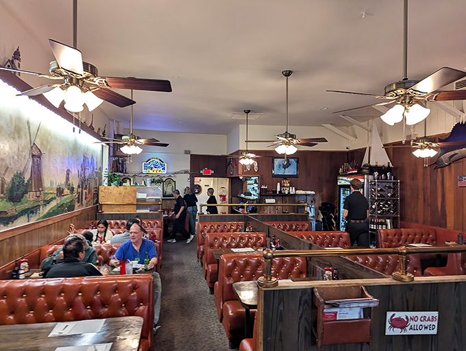 The dining room buzzes with the energy of satisfied customers. Every booth tells a story of seafood pilgrimages and family traditions.
